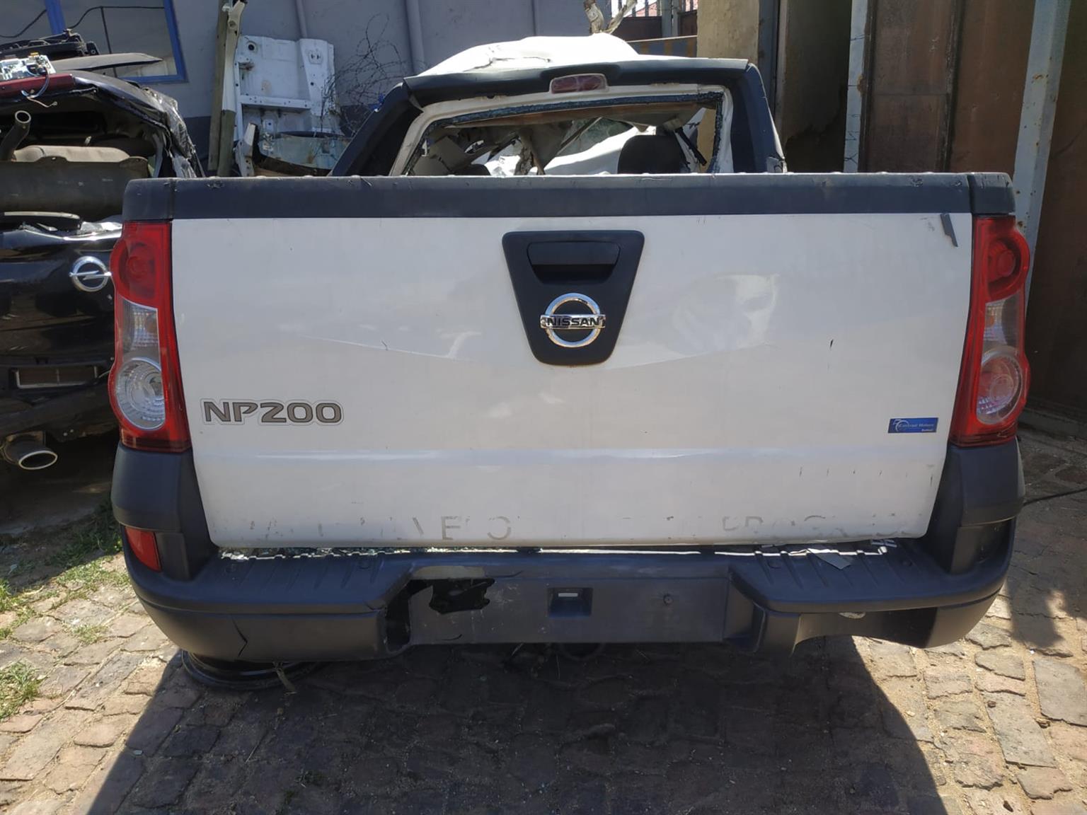 Nissan np200 np 200 complete tailgate / tail light | Junk Mail Marketplace