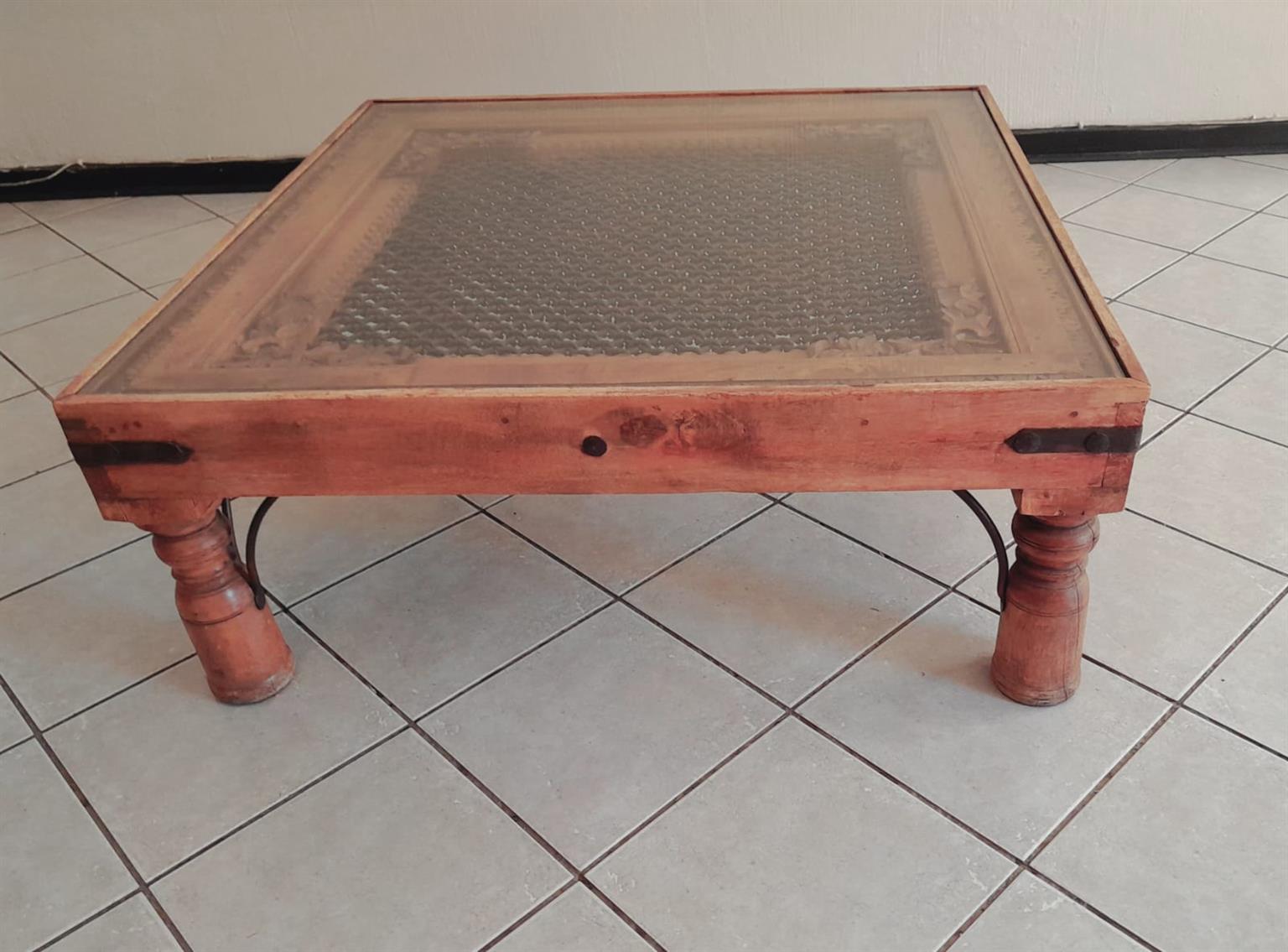 Large hand carfed wood and metal coffee table | Junk Mail Marketplace