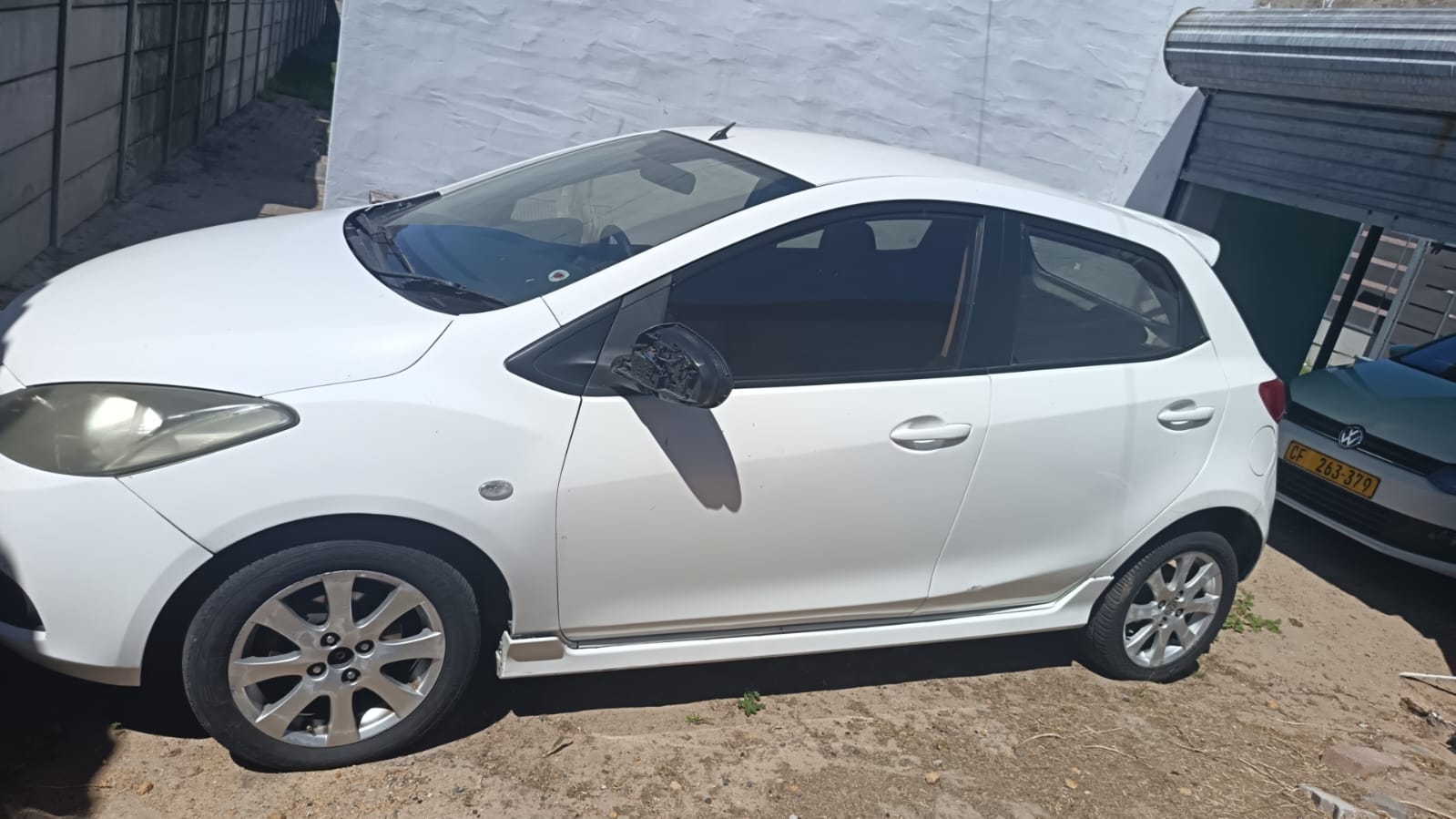 I'm selling a White Mazda 2,2007 ages 14 years old | Junk Mail Marketplace